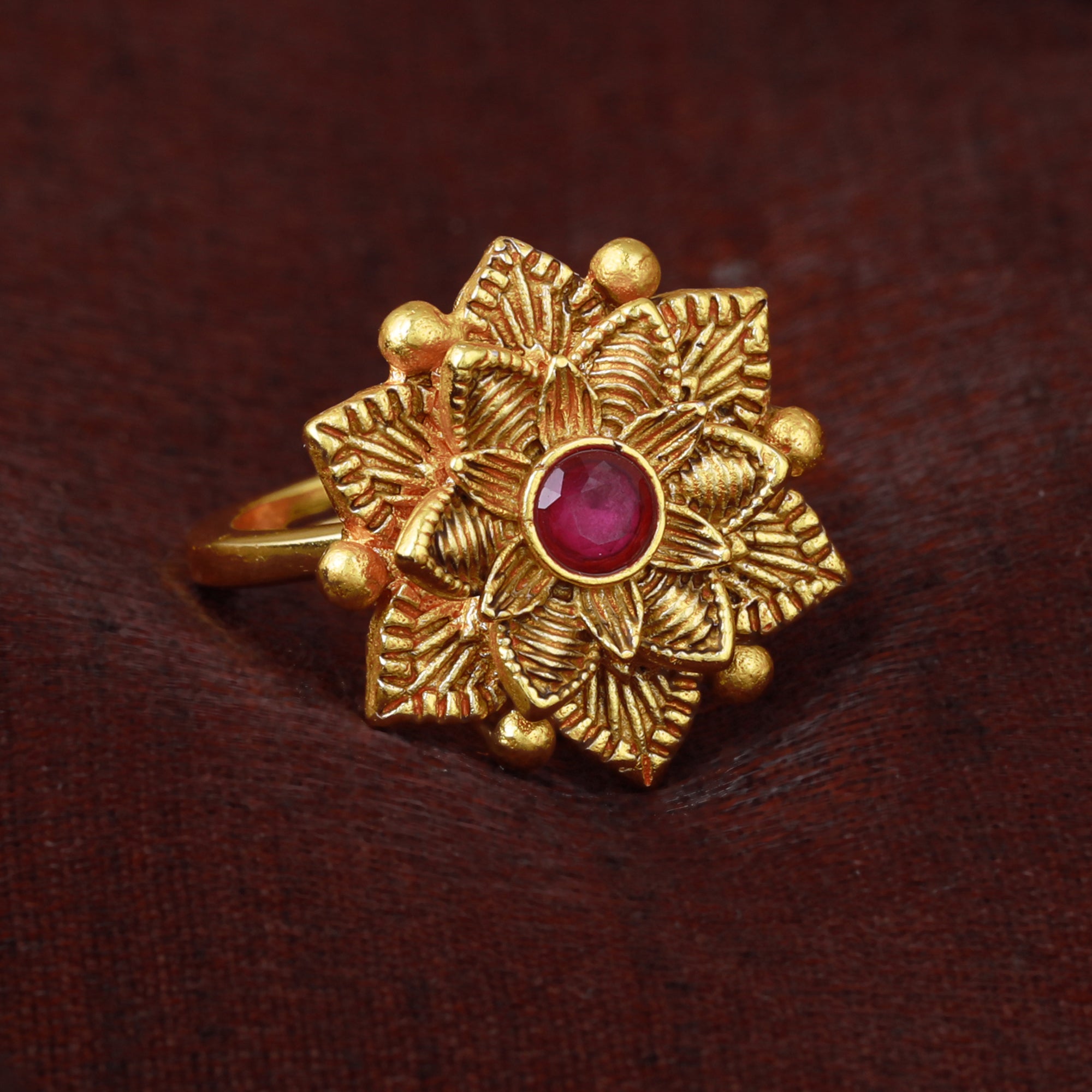 Estele Gold Plated Flower Designer Matte Finish Finger Ring with Ruby